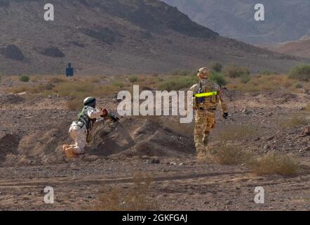 A platoon of Task Force Spartan Soldiers moves their Humvees, center of ...