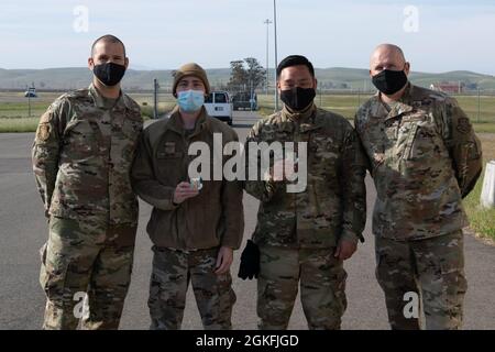 U.S. Airmen with the 60th Aerial Port Squadron load cargo onto a C-17 ...