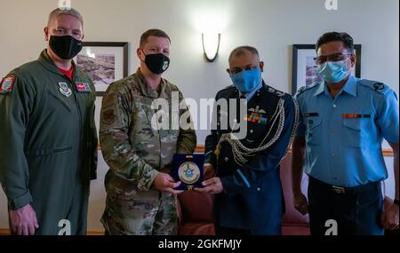 From left, Cols. Michael Peeler, 436th Operations Group commander, and ...