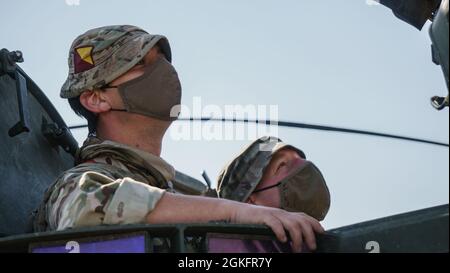 British Army Fusilier Johnson and Taylor, 3rd UK Division, sit atop a ...