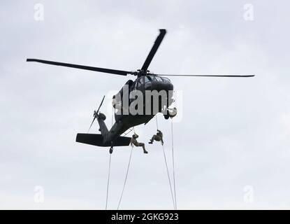 Soldiers rappel from a UH-60 Black Hawk helicopter at Fort Bliss, Texas ...