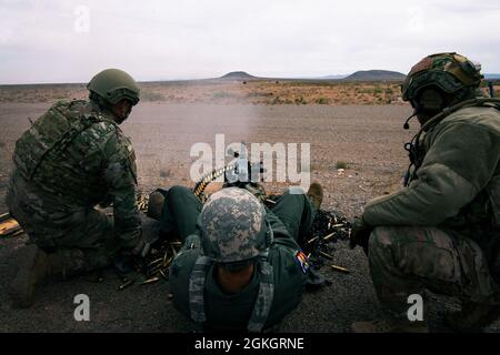 A 149th Fighter Wing member fires a 50 caliber machine gun while ...