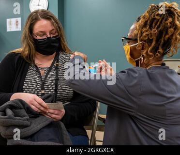 Beneficiaries receives dose of COVID-19 coronavirus vaccine in a ...