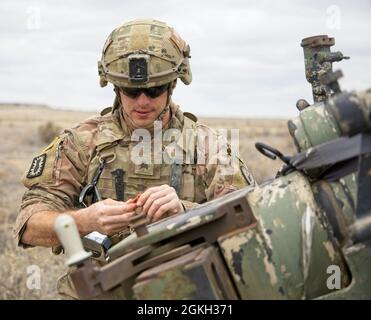 Sgt. Phillip Burson 79th EOD Bn., 752nd EOD Company directs his ...