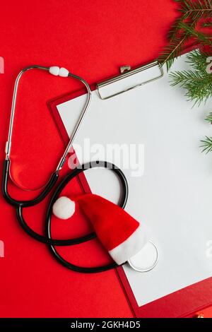 Christmas medical concept with stethoscope, gift box and christmas tree ...