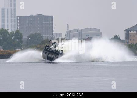 A Swedish CB90-class fast assault craft approaches the well deck of the ...