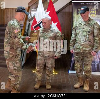 An Army first sergeant presents the command flag to William H. Taft IV ...