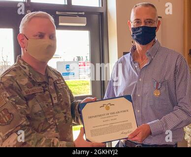 Col. Carl Magnusson, the 914th Air Refueling Wing commander, presents ...