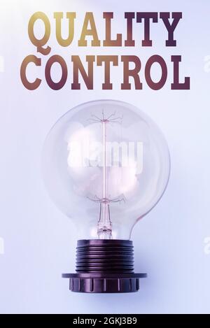 Text sign showing Quality Control. Business photo showcasing system of ...