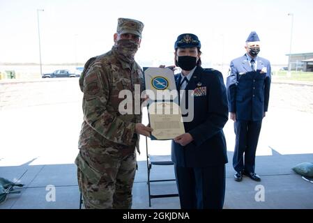 Col. Sean Riley, 102nd Intelligence Wing Commander, pins the ...