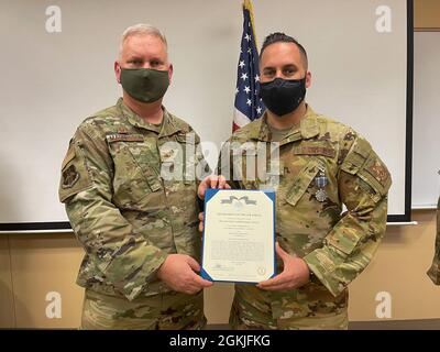 Col. Carl Magnusson, the 914th Air Refueling Wing commander, presents ...