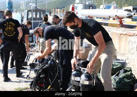 U.S. Army and Albania Navy divers exit the Bay of Vlore after ...