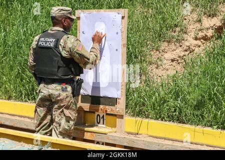 Tactical pistol shooting at a paper target at a shooting range. 3d view ...