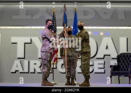 Col. Greg Moseley, 325th Fighter Wing commander (left), passes the ...