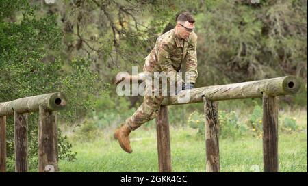U.S. Army Spc. Mitchell Robinson, assigned to U.S. Army North, rings ...