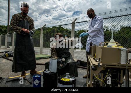 OKINAWA, Japan (May 12, 2021) Rear Adm. Fred Kacher, left, salutes Rear ...
