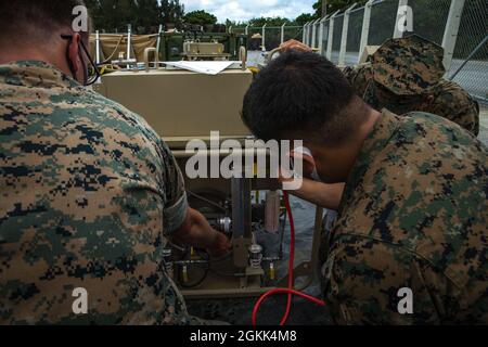 OKINAWA, Japan (May 12, 2021) Rear Adm. Fred Kacher, left, salutes Rear ...