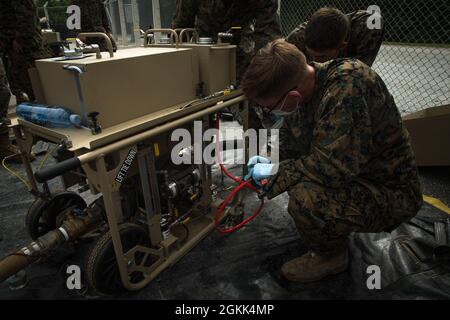 OKINAWA, Japan (May 12, 2021) Rear Adm. Fred Kacher, left, salutes Rear ...