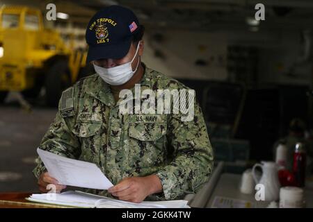 U.S. Navy Yeoman Third Class Alexandra Miller, right, from Annapolis ...