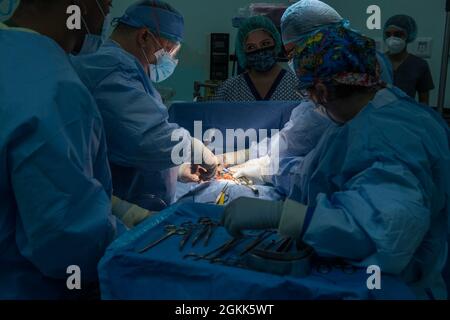 U.S. Army Lt. Col. Jesse Moskowitz, left, a surgeon with the Forward ...