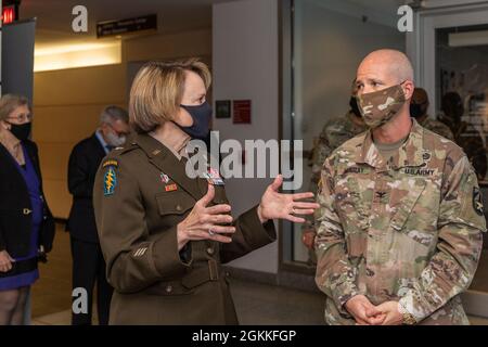 Col. Clinton Murray (right), WRAIR commander, provides an introductory ...