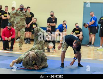 Rocky the Bulldog, 3rd Infantry Division mascot, fist bumps a student ...