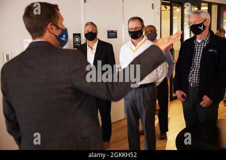 Col. Brian Beachkofski gives a tour of a Kessel Run office space to Maj ...