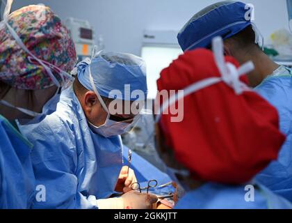 U.S. Army Lt. Col. Jesse Moskowitz, left, a surgeon with the Forward ...