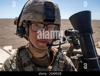 Specialist Barber, a gunner with the 2-116 Combined Arms Battalion, and ...