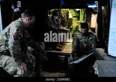 British Army Capt. Bryn Pugh, the Liaison and fire direction officer ...