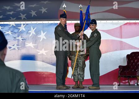 Col. Michael Alfaro, 4th Operations Group commander, presents the ...