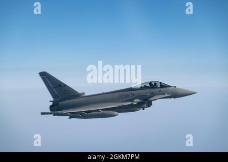 A Eurofighter Typhoon assigned to the Italian air force drops flares ...