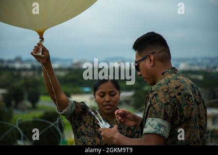 U.S. Marine Corps Cpl. Alicia Lucio, a Meteorological and Oceanographic ...