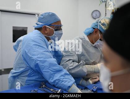 U.S. Army Lt. Col. Jesse Moskowitz, left, a surgeon with the Forward ...