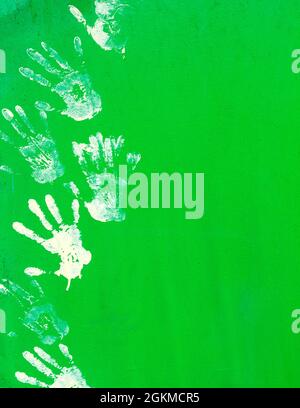 Green painted hand print on a grunge wall Stock Photo - Alamy