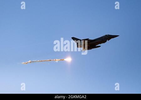 A Eurofighter Typhoon assigned to the Italian air force drops flares ...