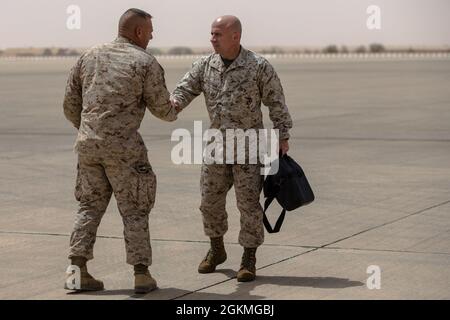 U.S. Marine Corps Col. Farrell J. Sullivan, right, commanding officer ...