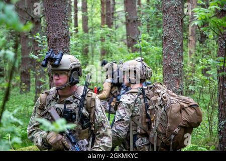Latvian Special Operation Forces (SOF) soldiers conduct a simulation ...