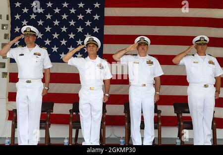 Cmdr. Michael A. Woodcock (left), officer in charge at the Naval Undersea Warfare Center ...