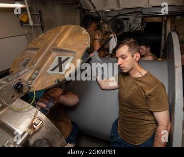 U.S. Navy Sailors attached to Underwater Construction Team (UCT) 2, and ...
