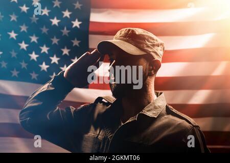 Memorial day. A uniformed soldier salutes against the background of the ...