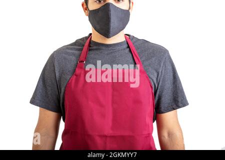 Baker man wearing a red apron standing in a wheat field and holding ...