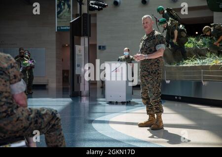 U.S. Marine Corps Col. Bret M. Hyla, left, assumes his duties as the ...