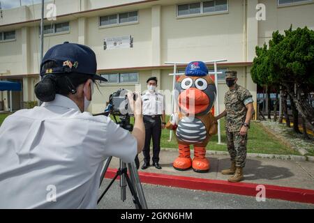 U.S. Marine Corps Col. Omar Randall, left, off-going commanding officer ...