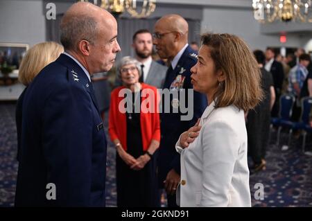 The wife of Lt. Gen. Robert Miller laughs during his promotion ceremony ...