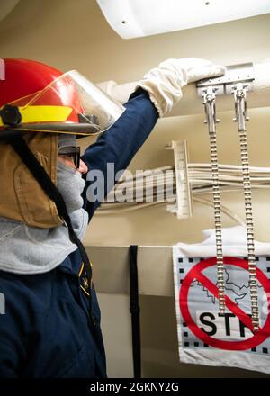 US Navy Legalman 2nd Class dons her Self-Contained Breathing Apparatus ...