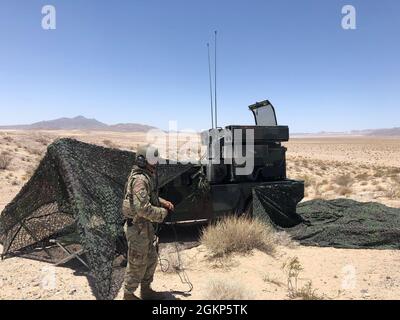 Soldiers with the 1-265th Air Defense Artillery (ADA), deliver aid to ...