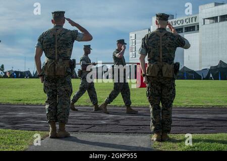 U.S. Marine Corps Col. Omar Randall, left, off-going commanding officer ...