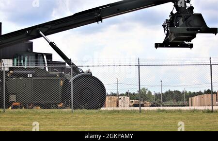 An Army Standard 50,000-pound-capable Rough Terrain Container Handler ...
