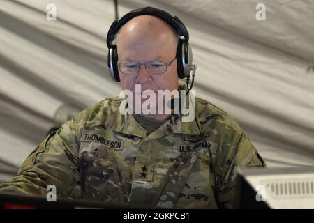 Indiana National Guard Maj. Gen. Timothy Thombleson, right, receives ...